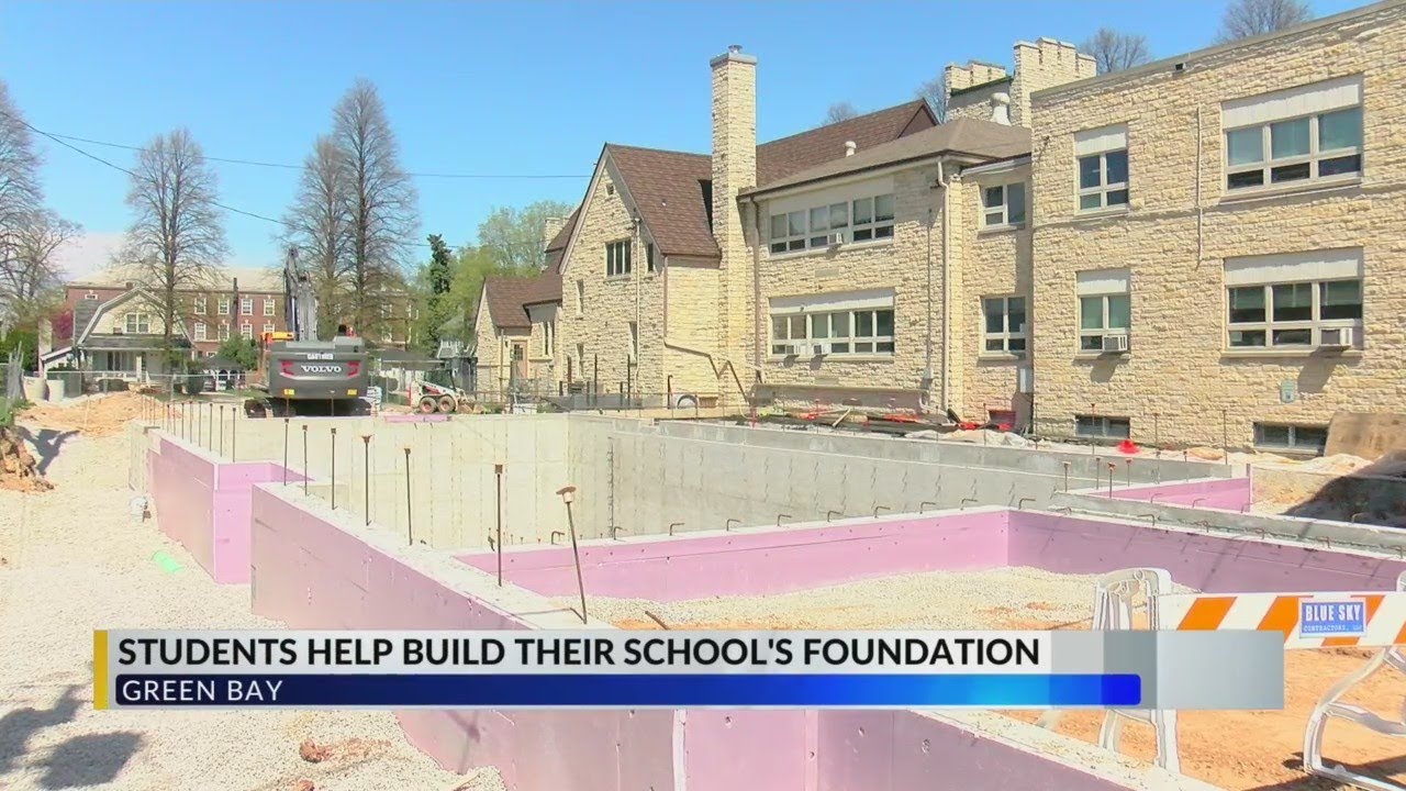 Students help build their school's foundation - YouTube