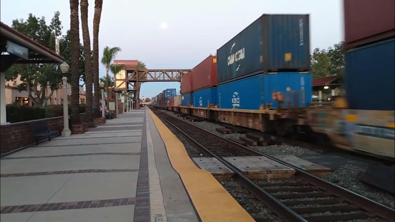 A BNSF GE Dash 9 leads a westbound intermodal train through Fullerton Station (read description ...