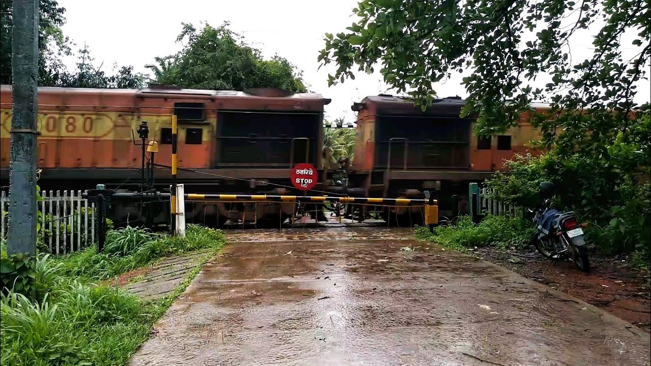 ERS ALCO Twins powered OKHA Ernakulam Express At a Railroad Level ...