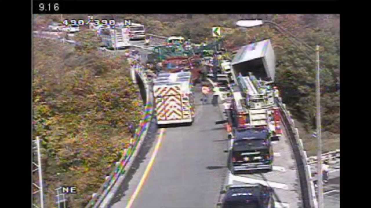 Tractor trailer hanging over side of bridge, driver trapped - Gates, NY ...