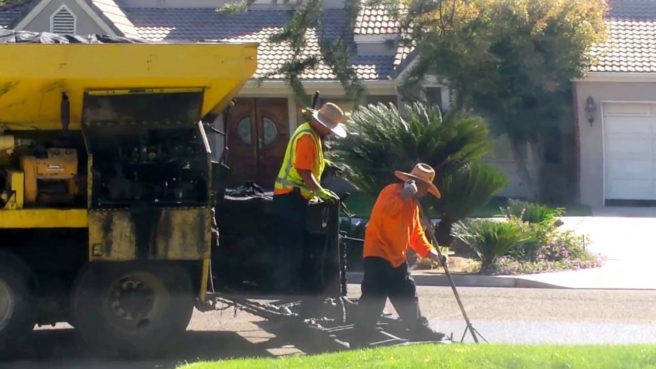 Road Slurry Seal fixing our road - YouTube