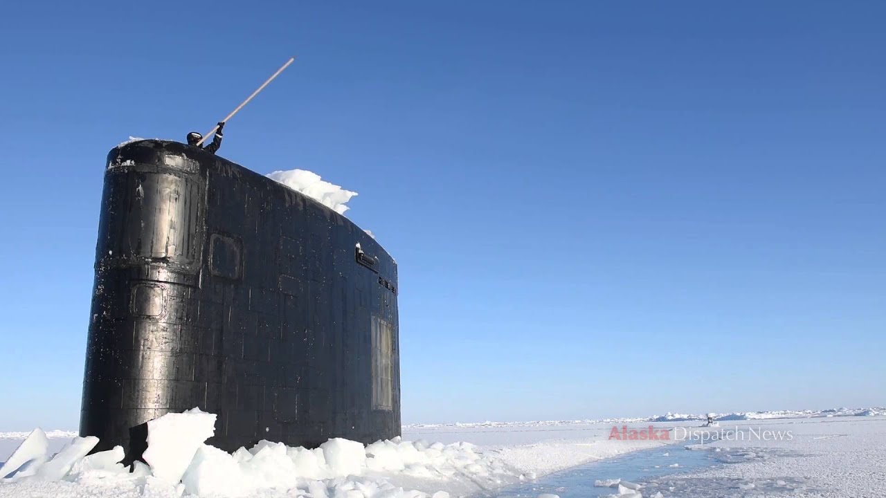 US Navy Submarine USS Hartford breaks through the Arctic Circle ice ...