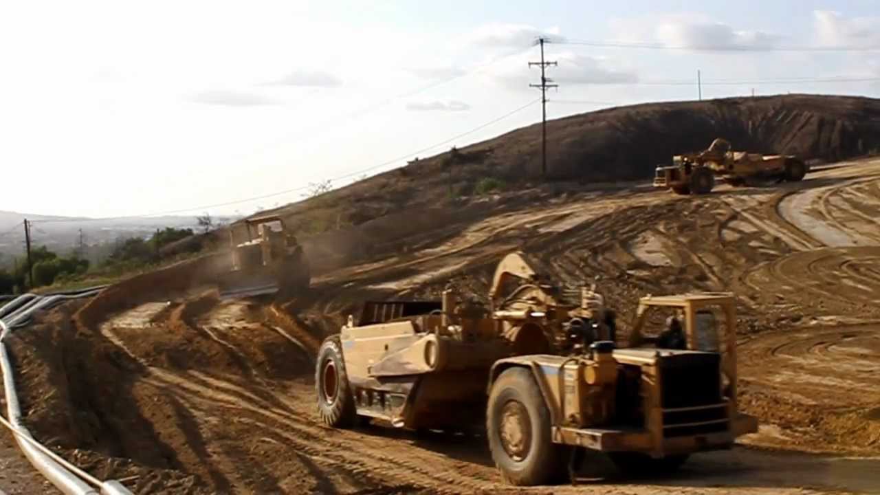 Cat D9L pushes 651 scrapers - YouTube