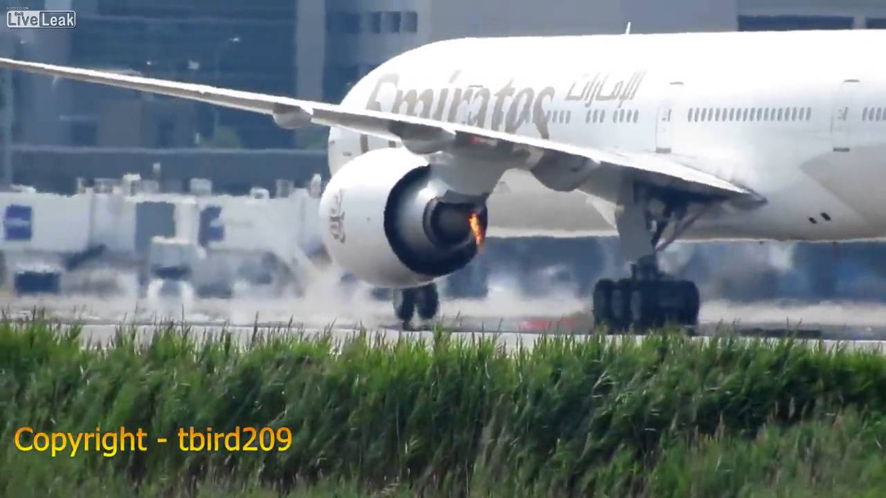 Emirates' B777 engine takes fire after landing - YouTube