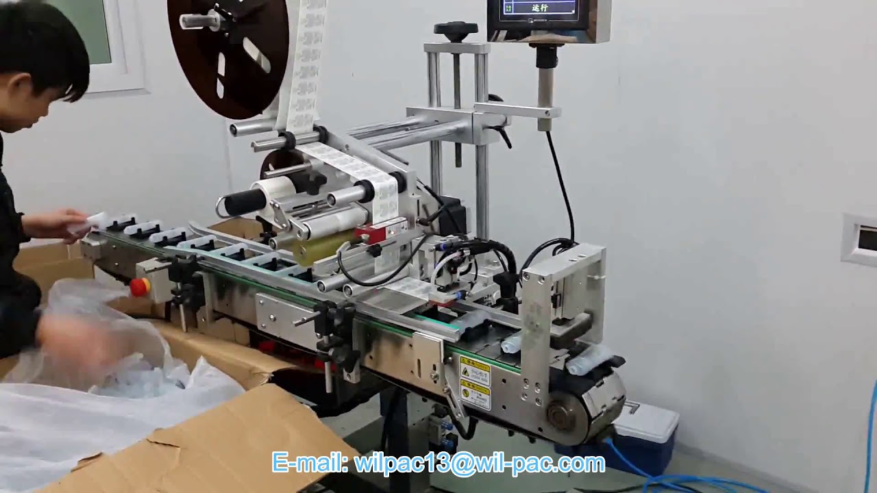 Automatic label suction labeling machine operation video from Wilpac ...