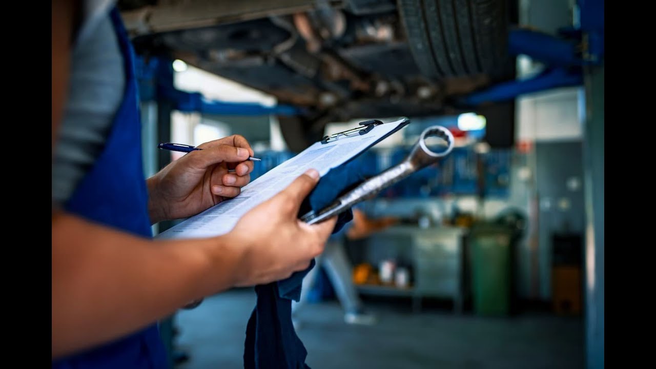 Paint check on a Porsche 911 using a paint measuring machine. This car ...