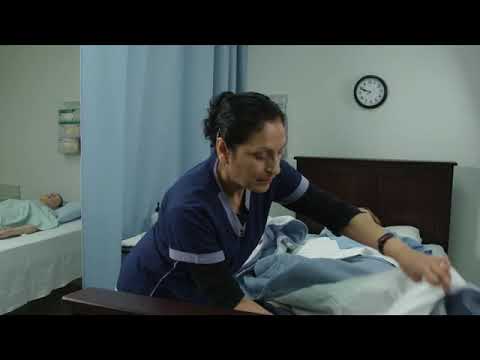 Dressing a bedridden resident