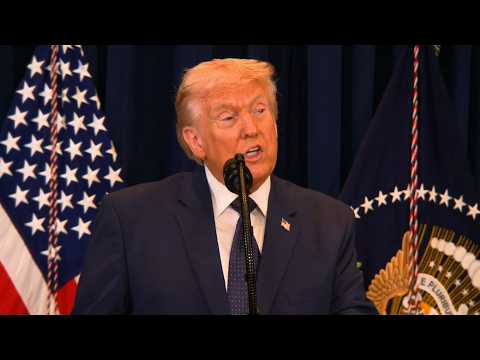 Donald Trump takes questions from reporters