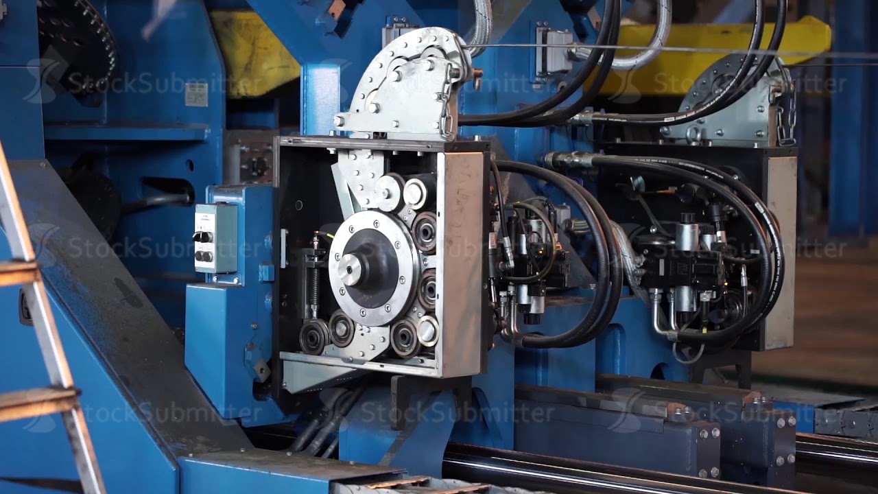 wire rolling mill coil forming laying head at steel plant - YouTube