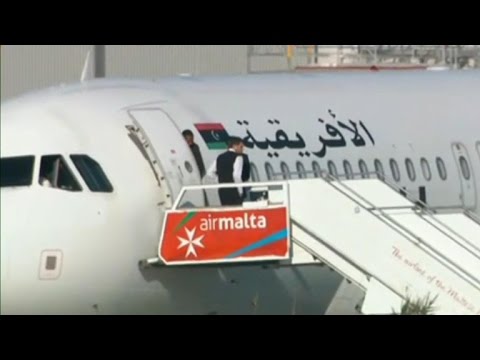 Libyan plane hijackers surrender to Malta police - YouTube