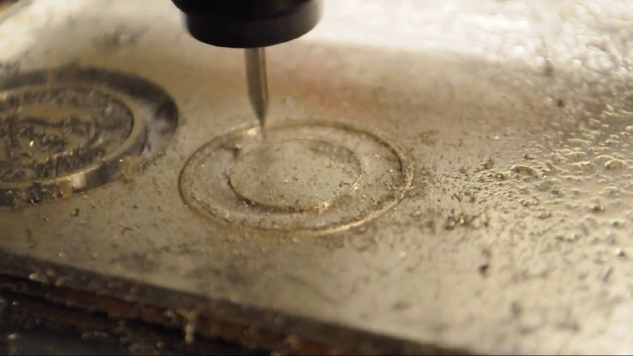 cnc engraving a key coin on home made cnc router - YouTube
