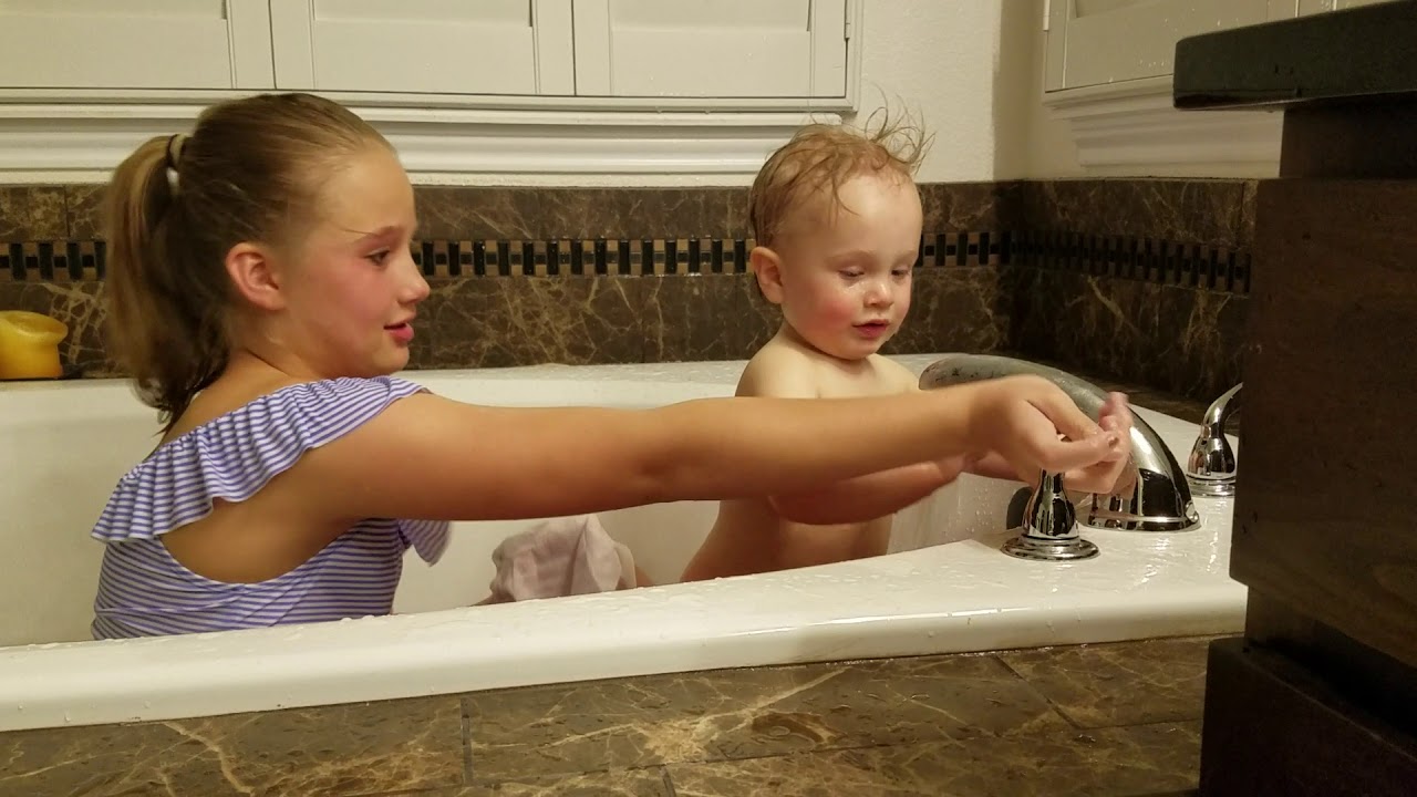 Sister and baby playing in bathtub - YouTube