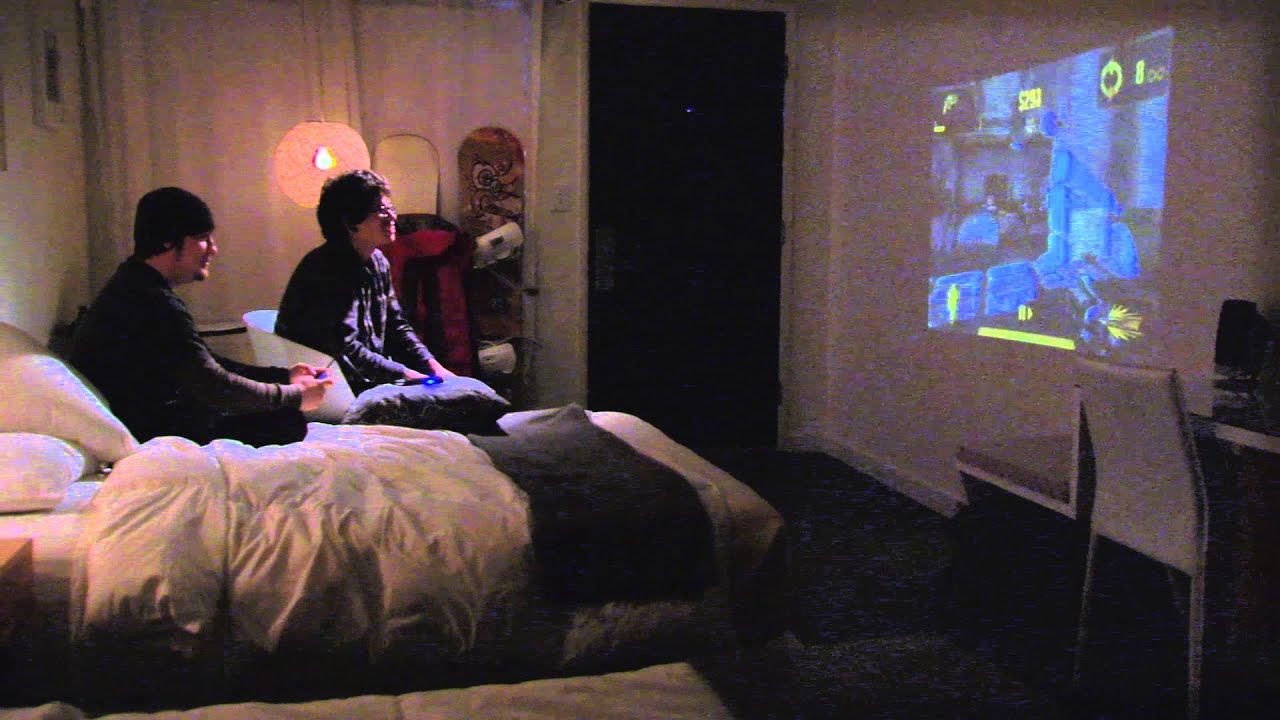 MicroVision SHOWWX+™ Laser Pico Projector Gaming App Demo RAGE HD - YouTube