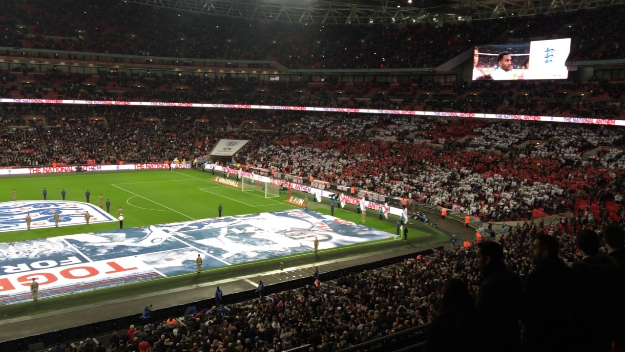 Crowd singing England national anthem God Save Out Queen at Wembley ...