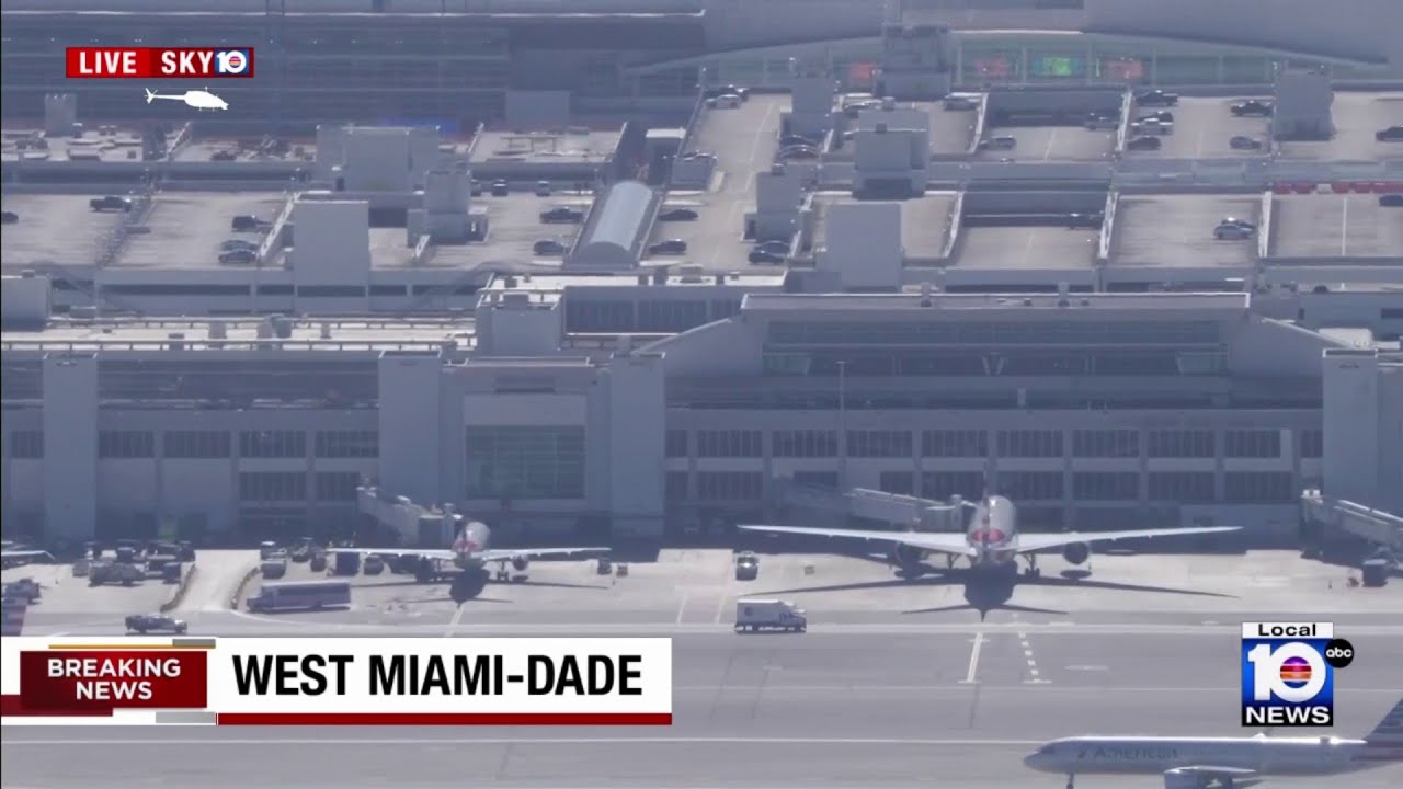 Vehicle fire at MIA parking garage halts people mover, no injuries ...