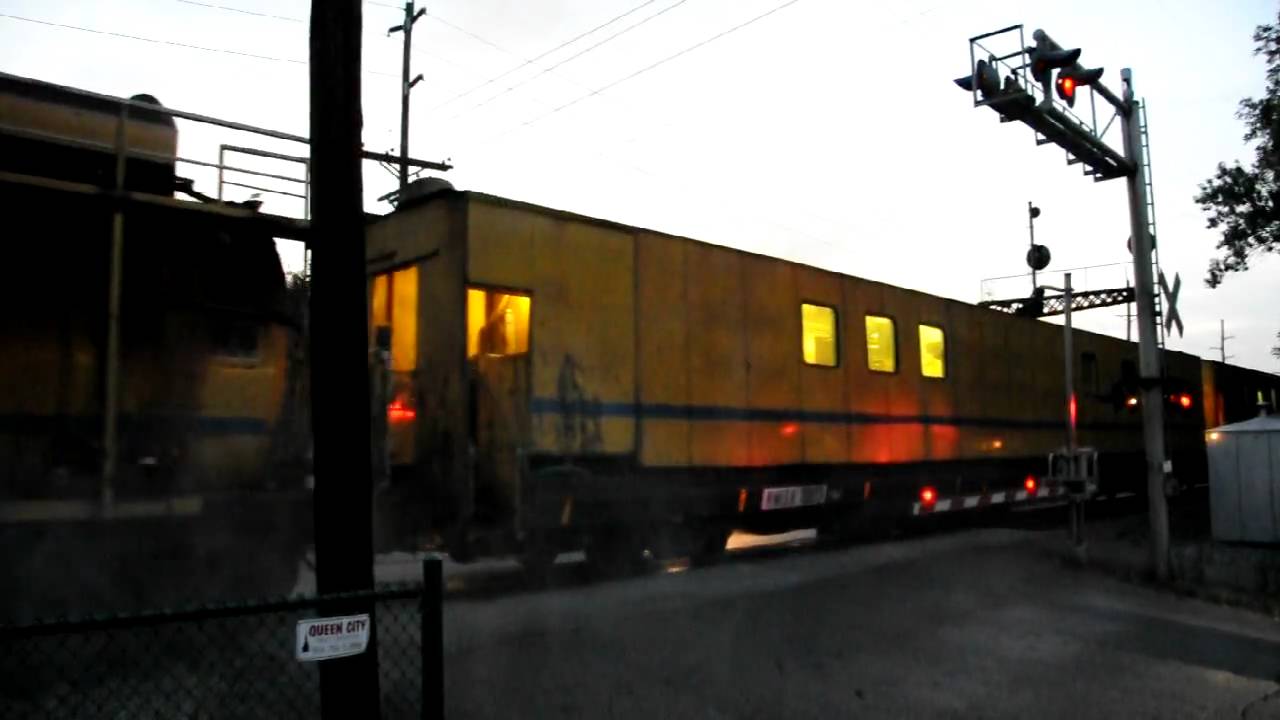 HTT Rail Grinder meets CSX freight at dusk - YouTube
