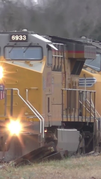 UP 6933 leads a Manifest into Coffeyville Yard with a Flared SD70M and UP 1989 #unionpacific ...