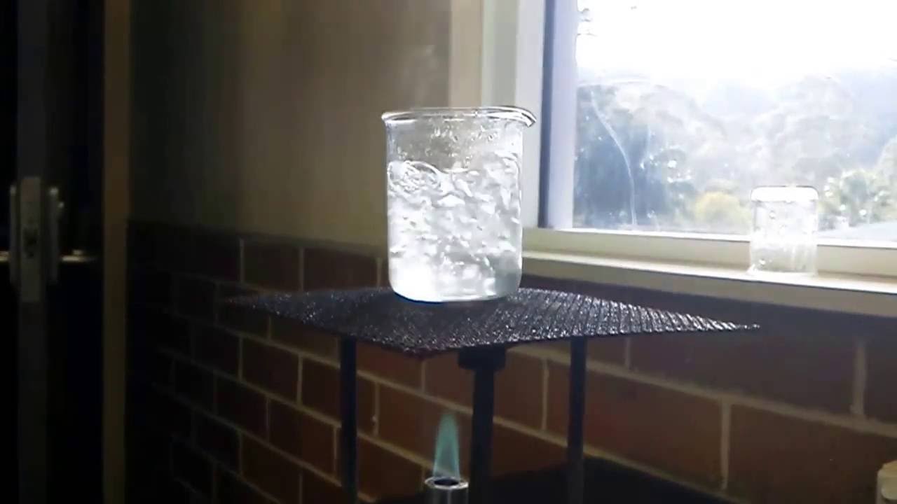 Water boiling over bunsen burner - YouTube