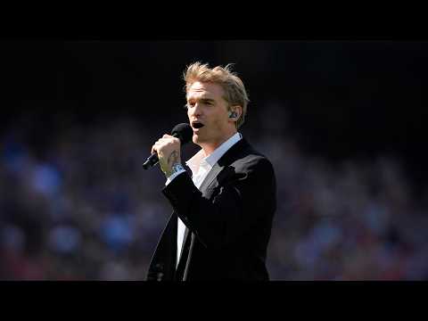 Cody Simpson performs the Australian National Anthem at the Melbourne Game