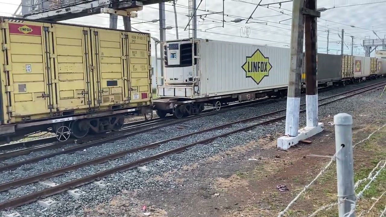 Aurizon 2833 train coming past Burrum street train bridge with IMU102 ...