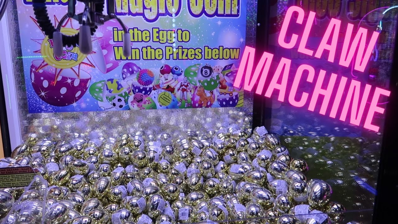 Playing the Golden Egg Claw Machine at the Arcade - What's Inside the ...