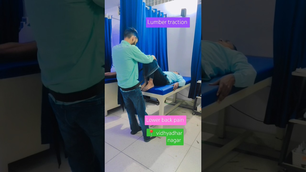 manual lumber traction for lower back pain with Mulligan belt # ...