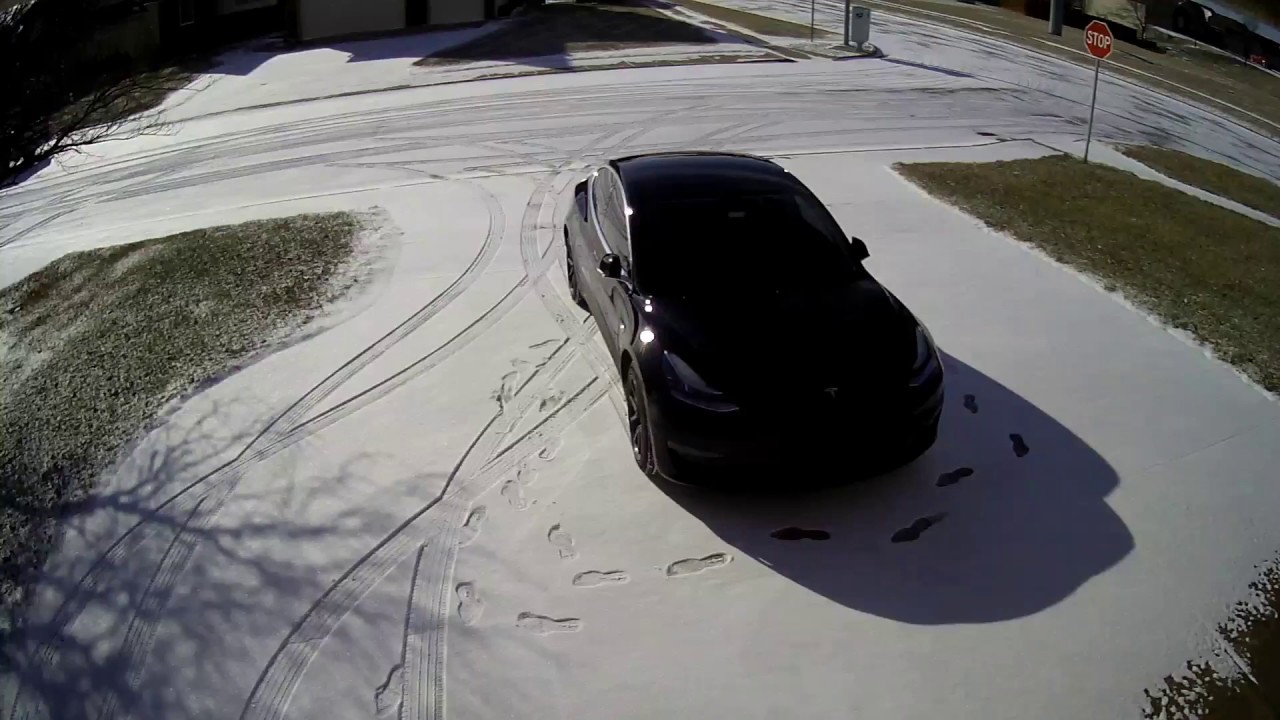 Tesla sliding down the driveway - YouTube