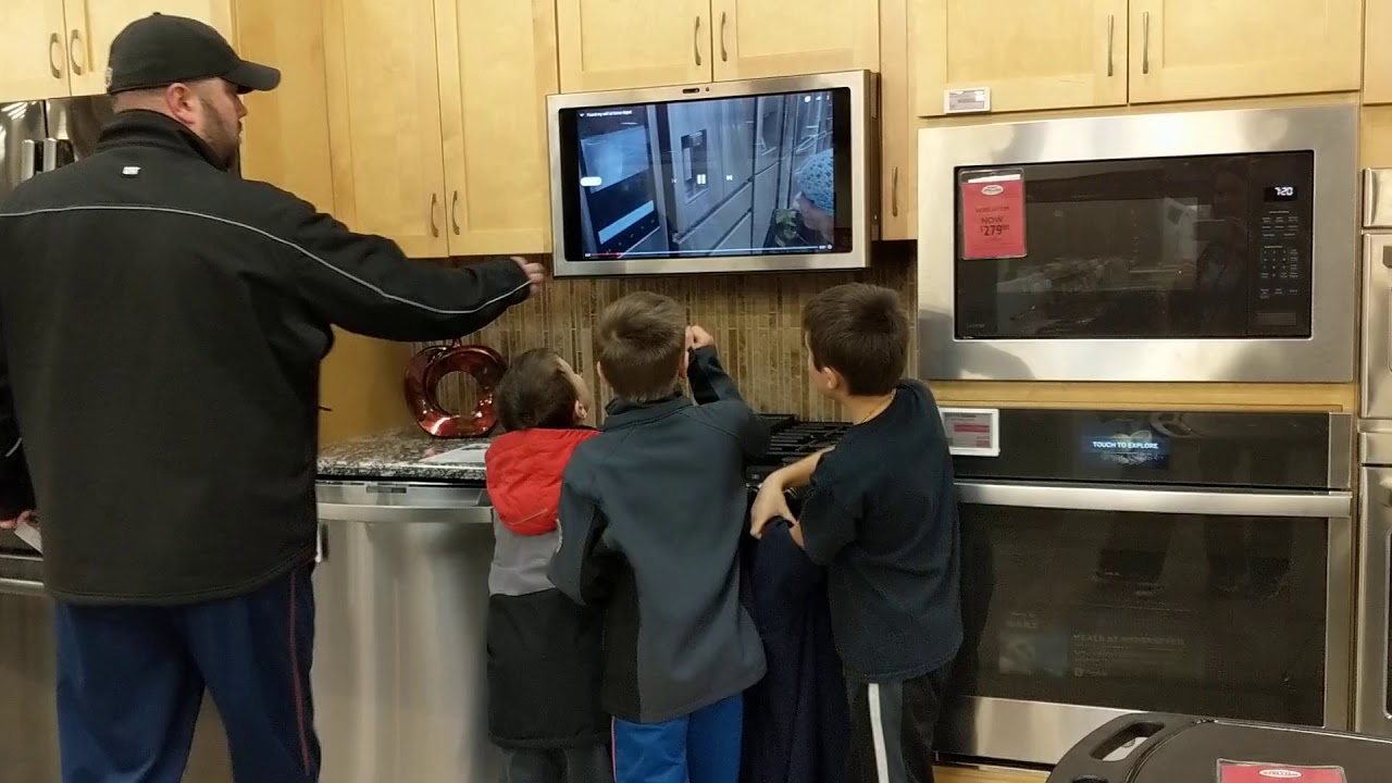 Watching himself watch himself watch himself on a microwave - YouTube