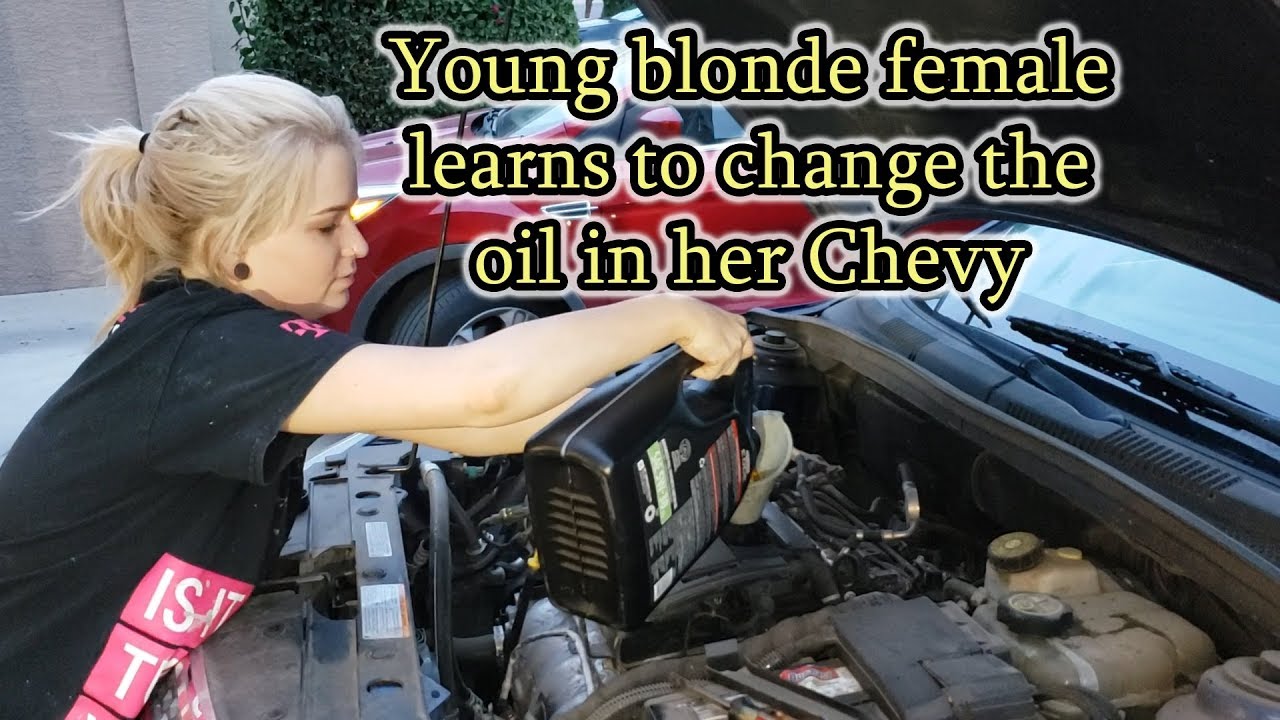 Young blonde female learns to change the oil in her Chevy - So it don't ...