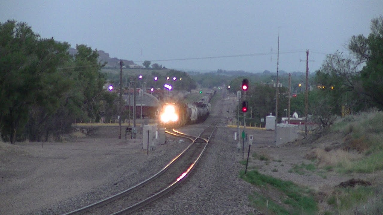 Sundown and a noisy BNSF H train is crawling uphill and out of the ...
