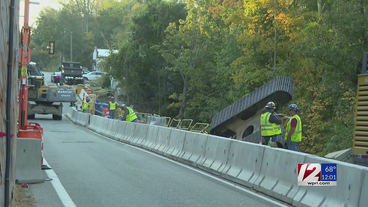 Excavator rolls over in Burrillville - YouTube