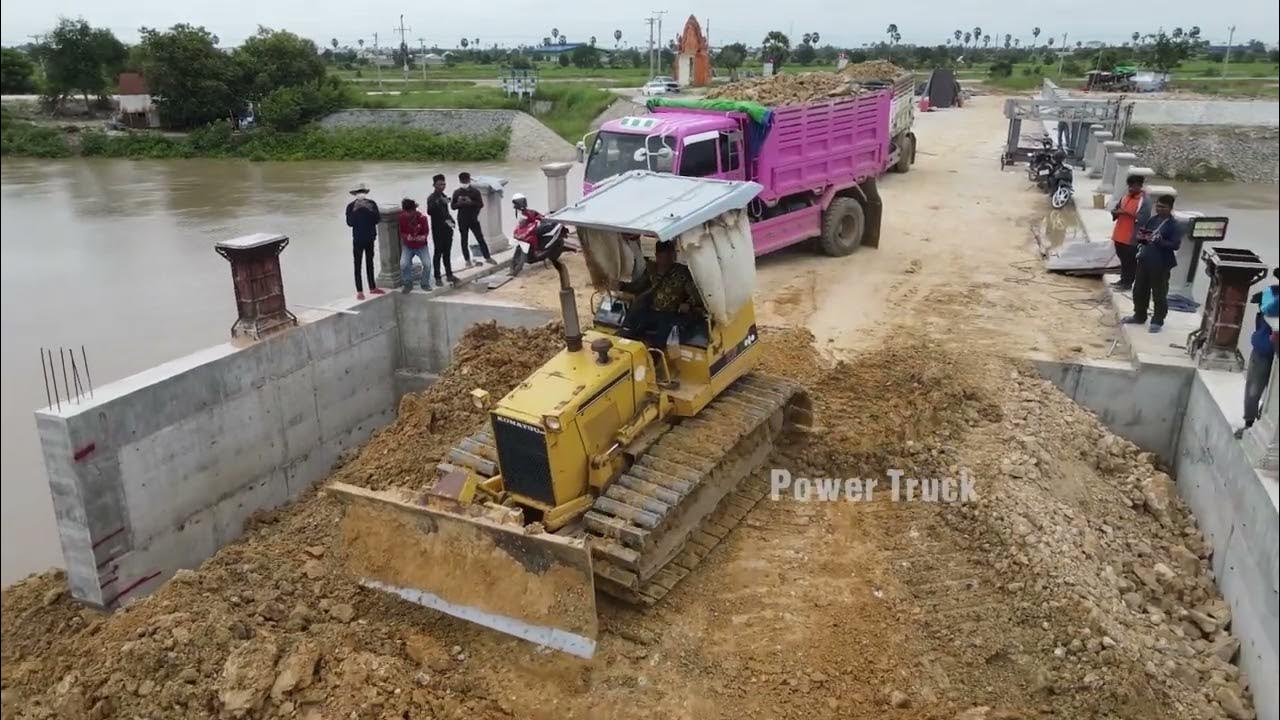 Good Technique Building New Foundation Road Connecting the Bridge by Dozer KOMATSU D31P, Dump ...