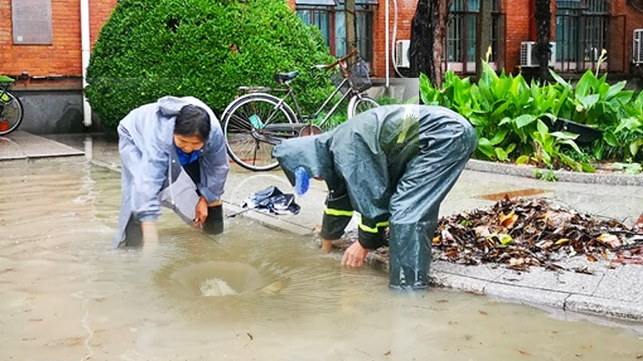 Unclogging a Clogged Culvert Drain Clearing a Blocked Culvert Drain ...