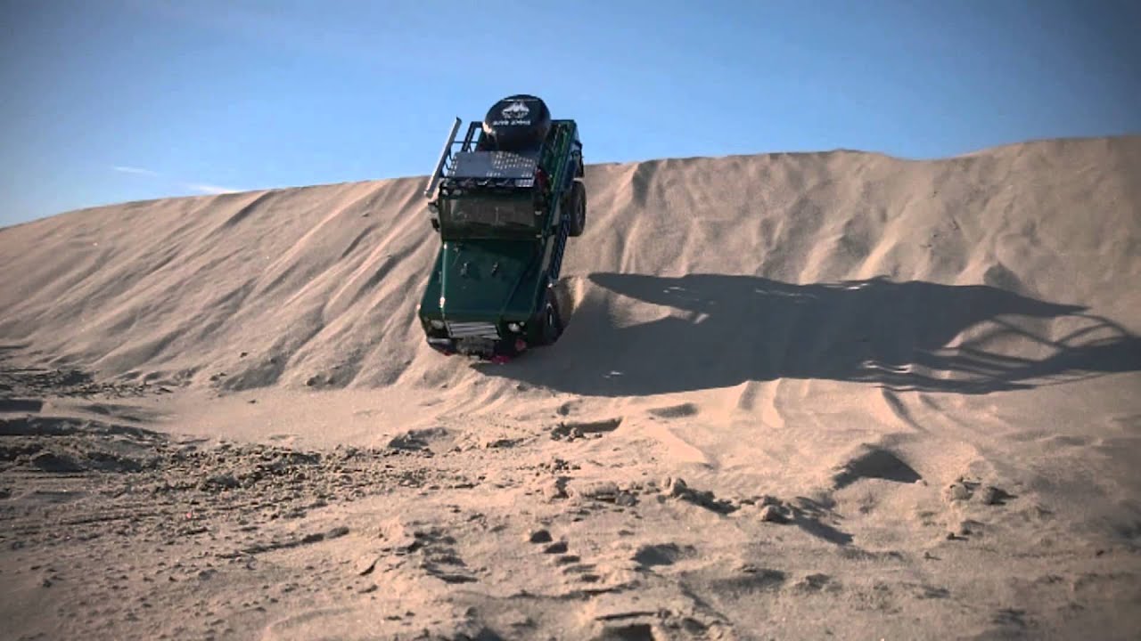 Scx10 axial defender in sand - YouTube