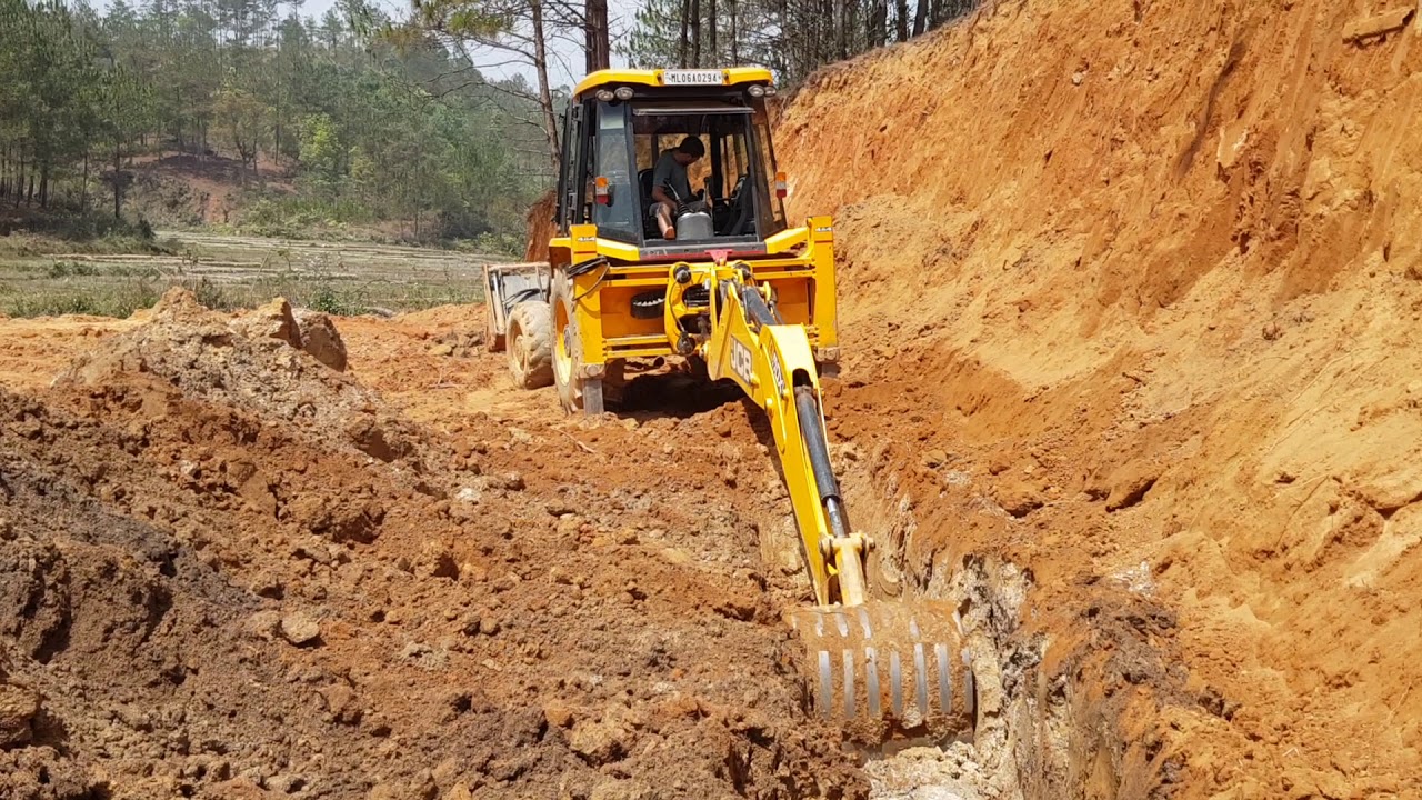 Jcb backhoe loader Constructing water drainage - YouTube