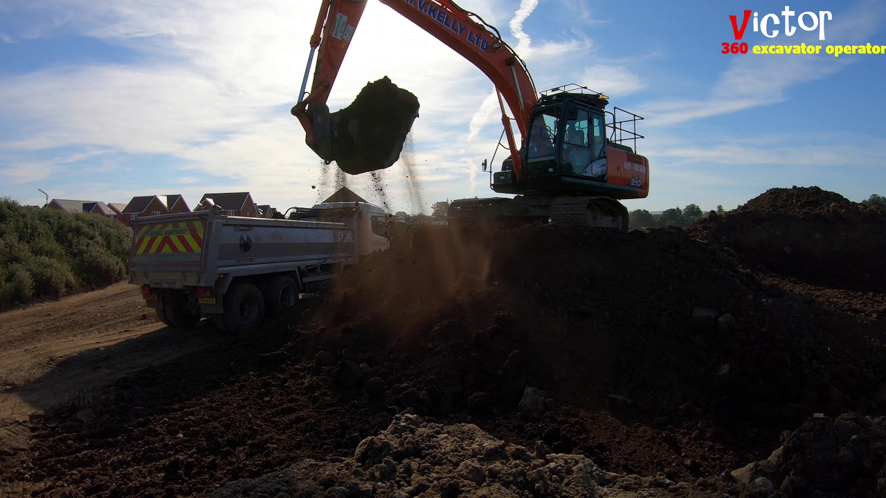 Hitachi ZAXIS 210LC Excavator loading a tipper truck - YouTube