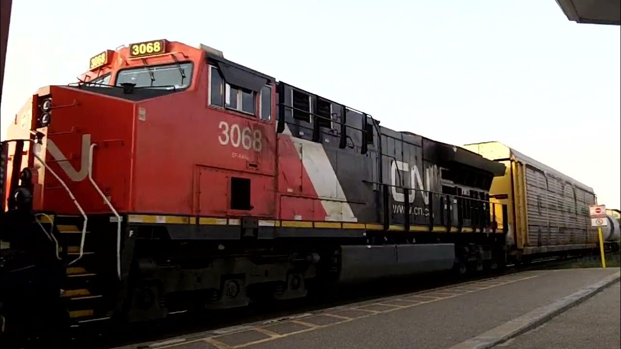 3+1/CN 383 w/CN Engines 3854, 3165 & 3195 lead this long 744 axle, WB Mixed/Autorack train by ...