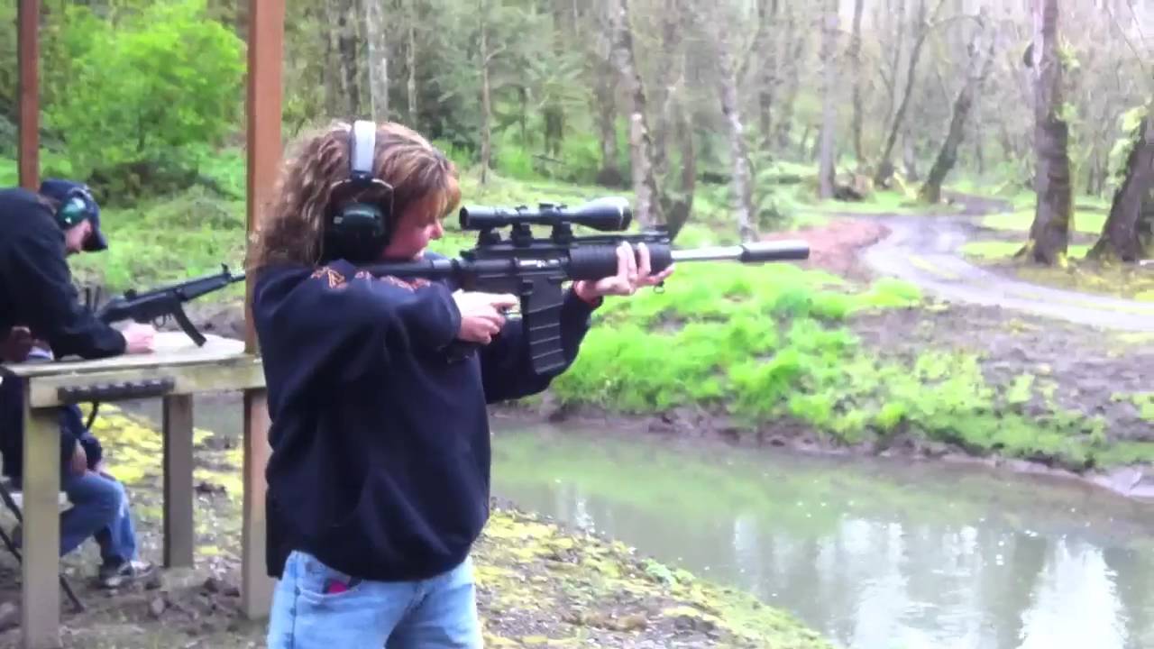 Girl shooting Ar-15 with silencer - YouTube