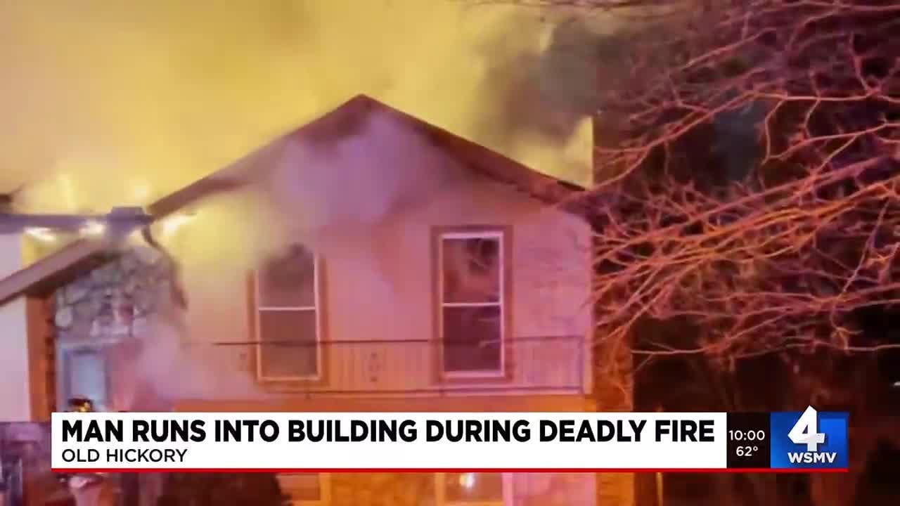Man runs into building during deadly fire - YouTube