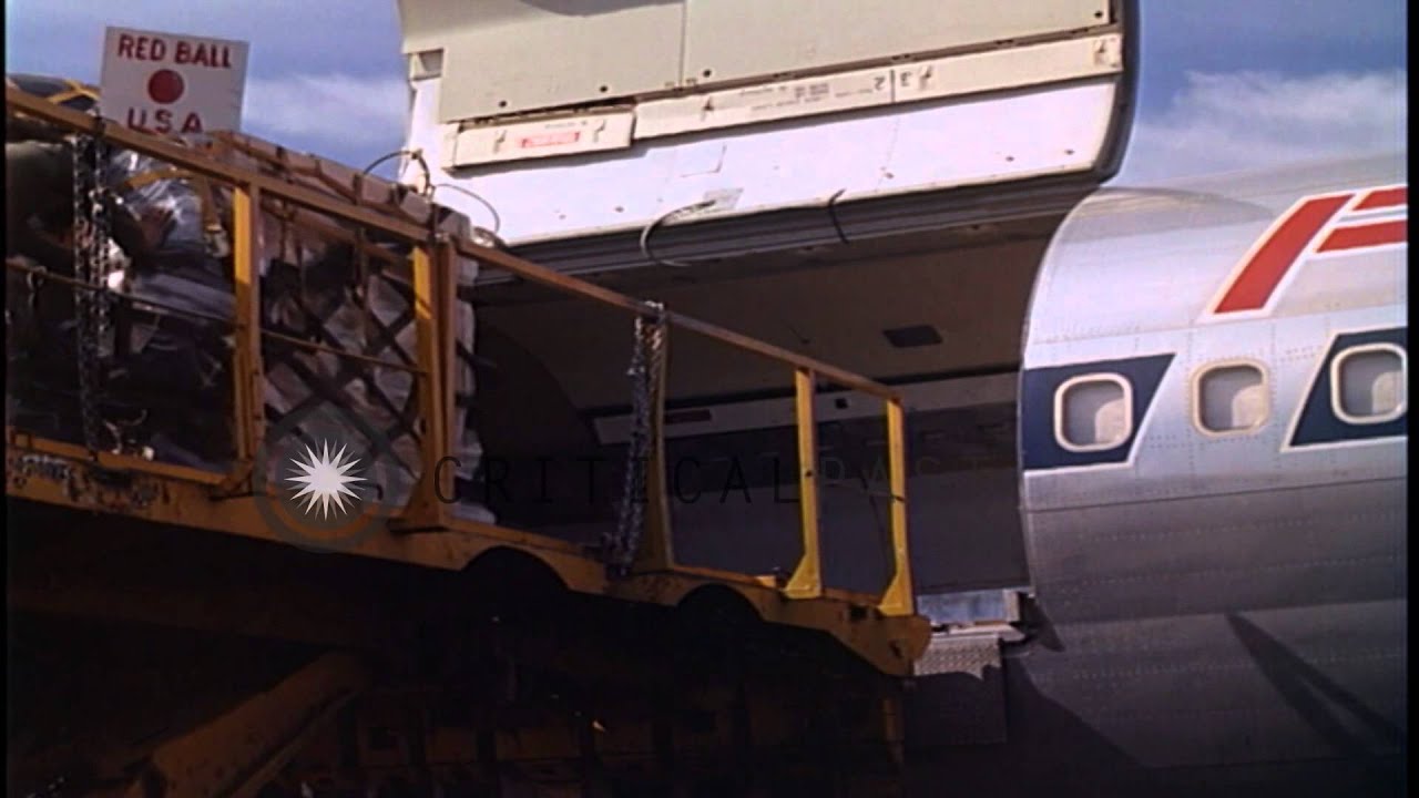 Pallets of supplies loaded into Flying Tiger Airline's Boeing 707 at ...