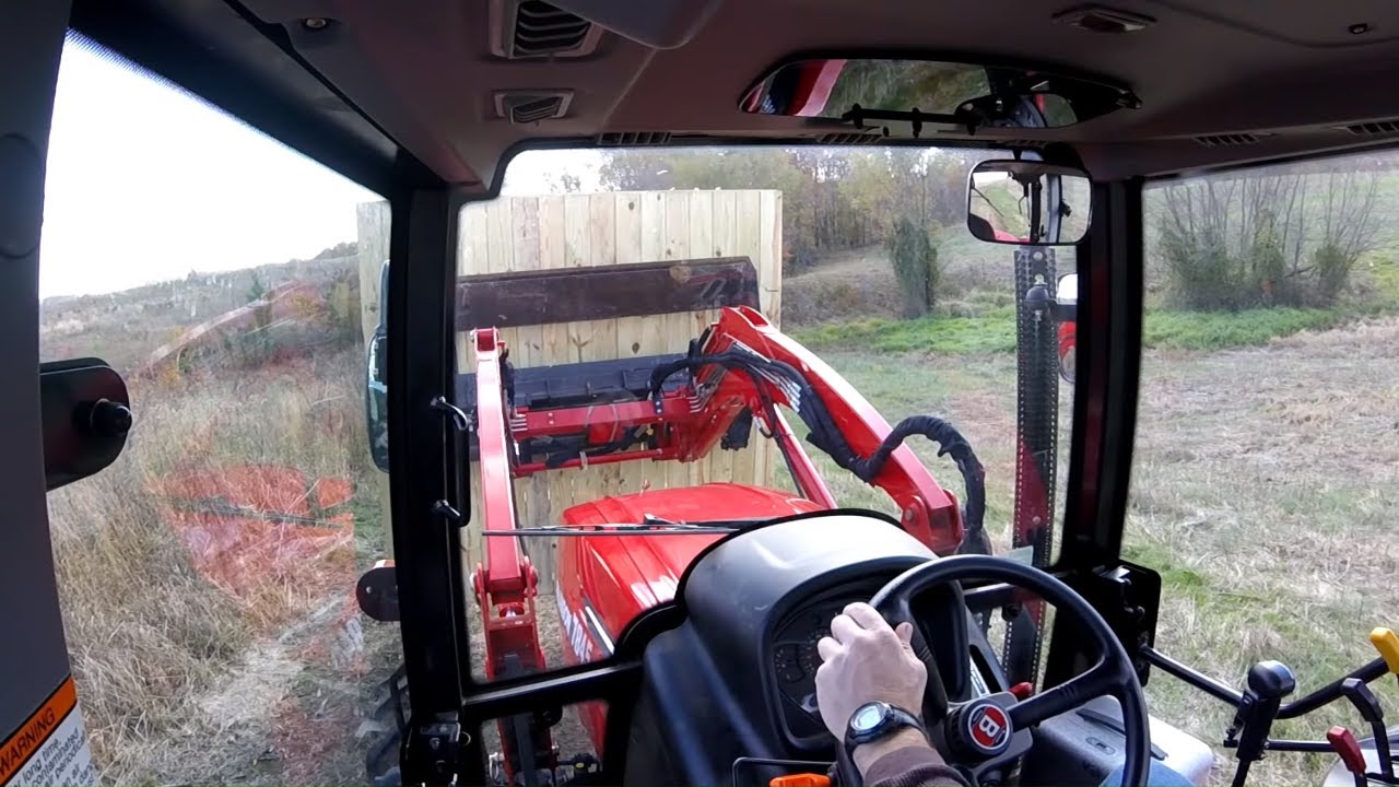 Negotiating a tractor tipping hazard with heavy weight on the loader ...