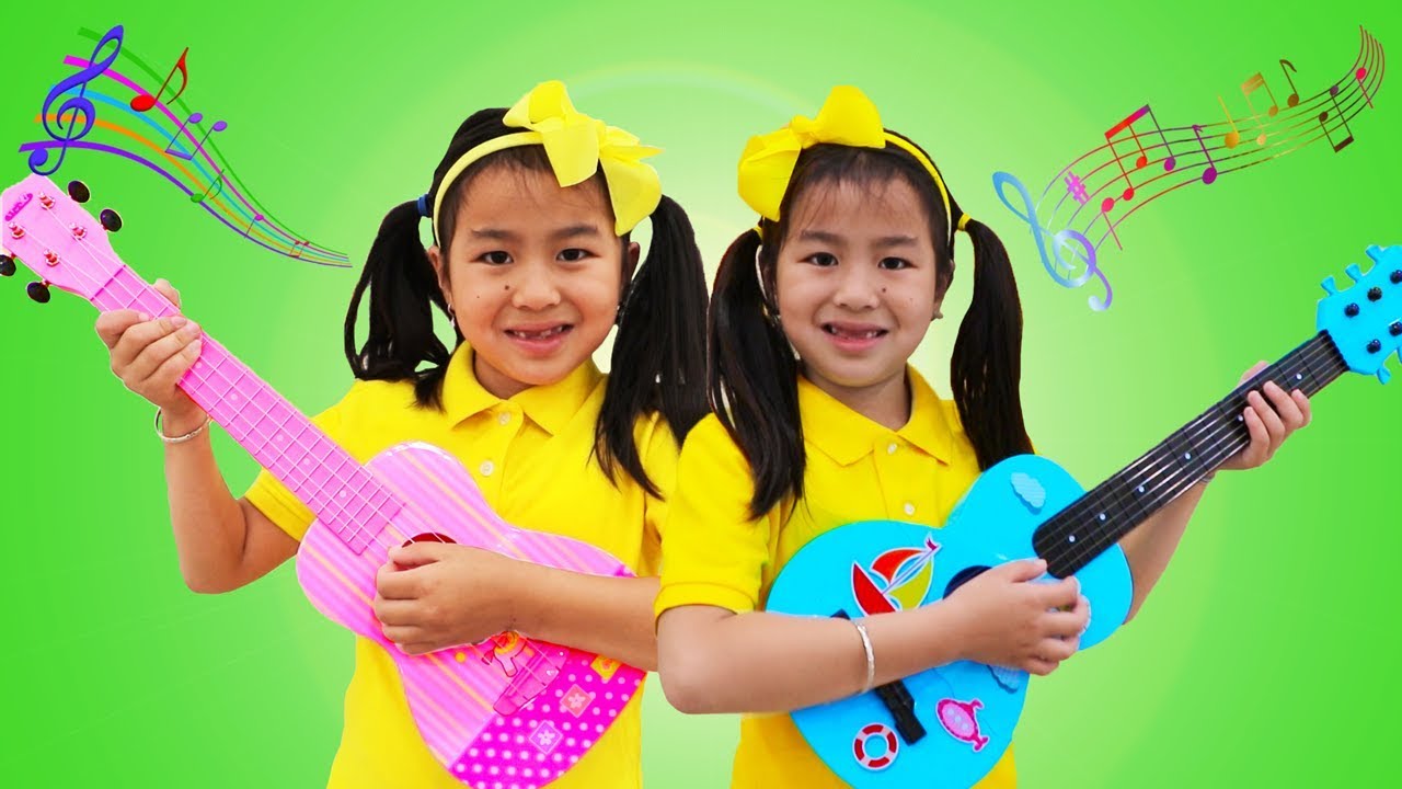 Jannie Plays Toy Guitar & Sings Kids Nursery Rhymes Songs at the Music ...