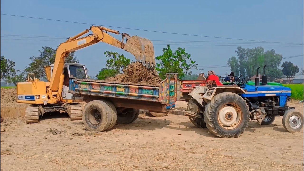 Jcb 3dx Eco Excellence Backhoe Machine Loading Red Mud In Eicher 242 ...