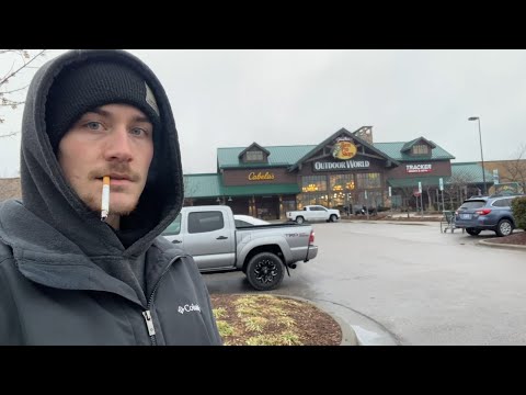 Smoking a Cigarette in a Bass Pro Shop Parking Lot