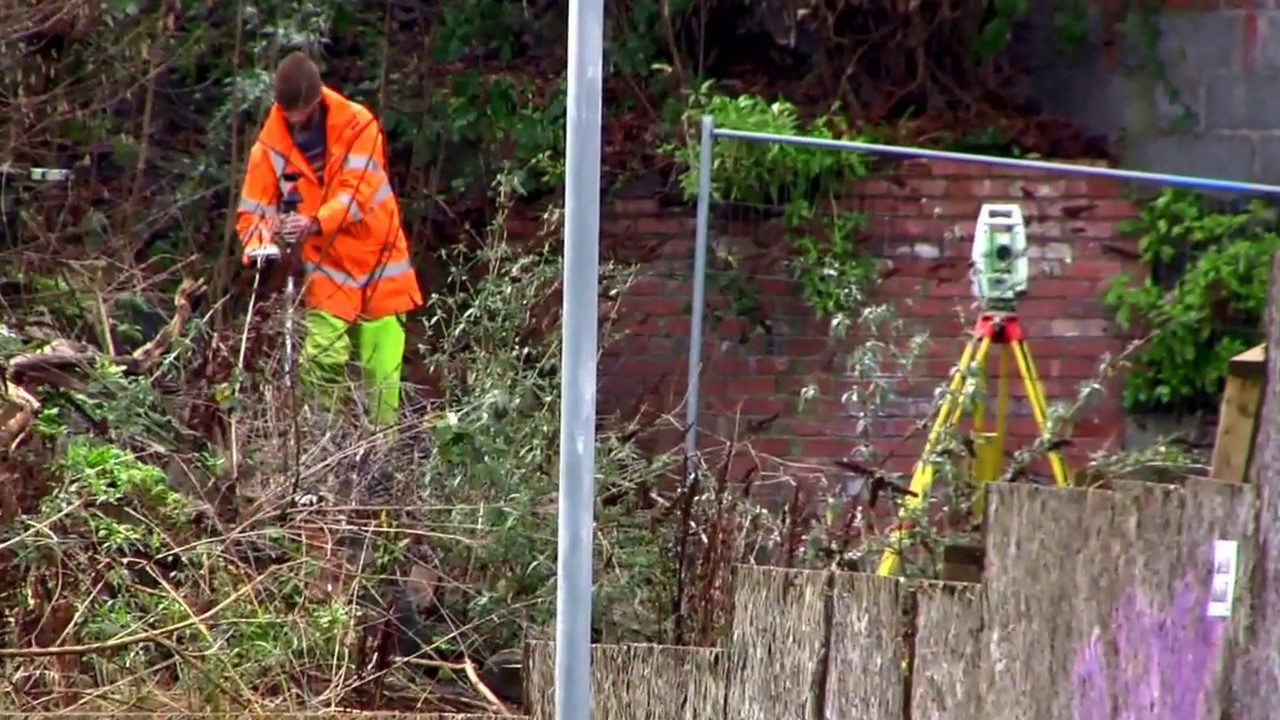 Land Surveyor at work on land secured for 'New Builds' - England (UK ...