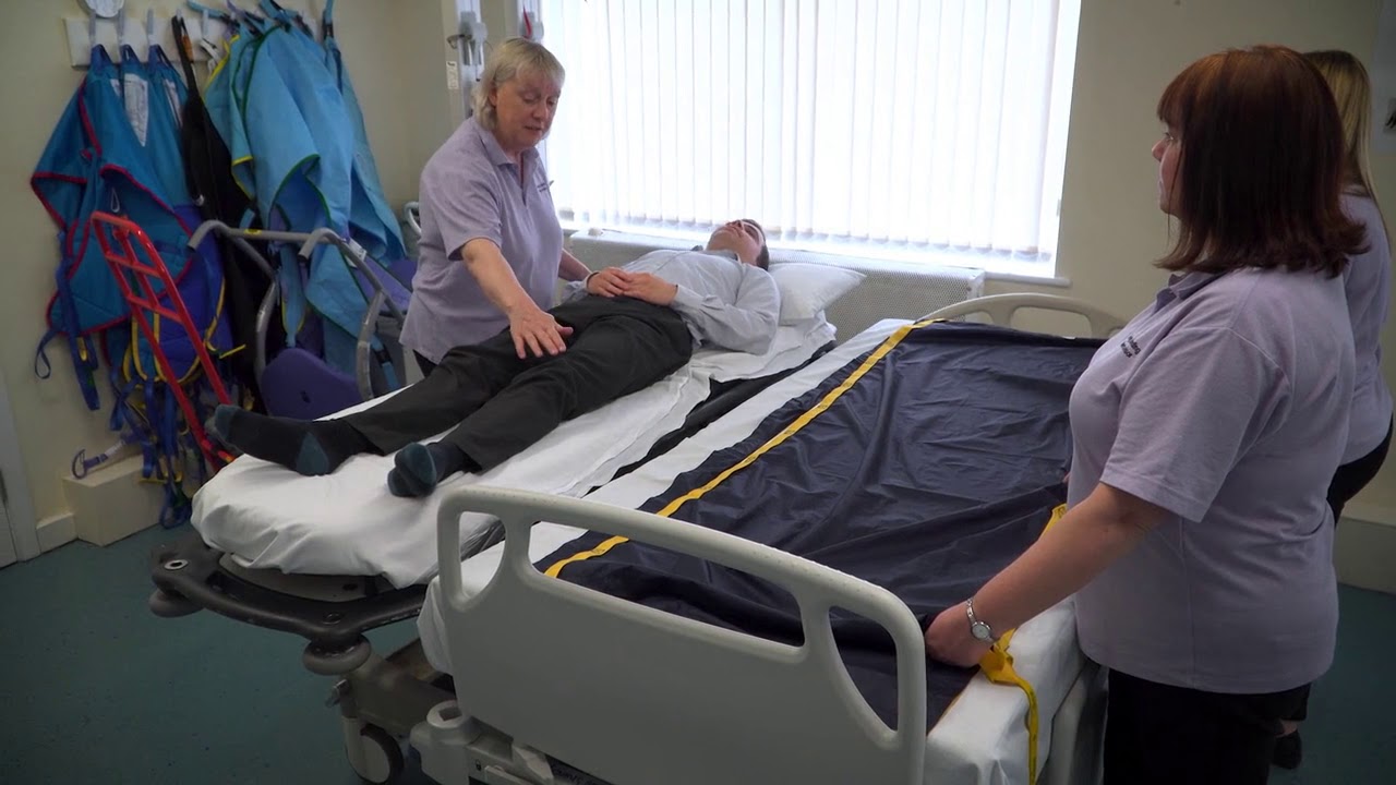 Pat Sliding Patient Trolley To Bed - YouTube