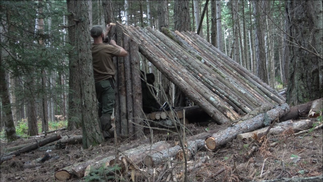 Bushcraft in the woods super shelter building, cooking chicken over the ...