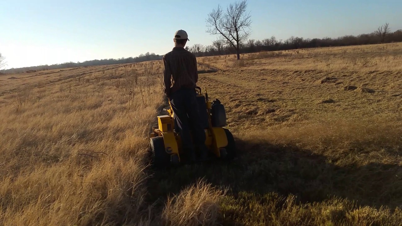 Cutting down a bermuda grass pasture with MFLC, Inc. - YouTube