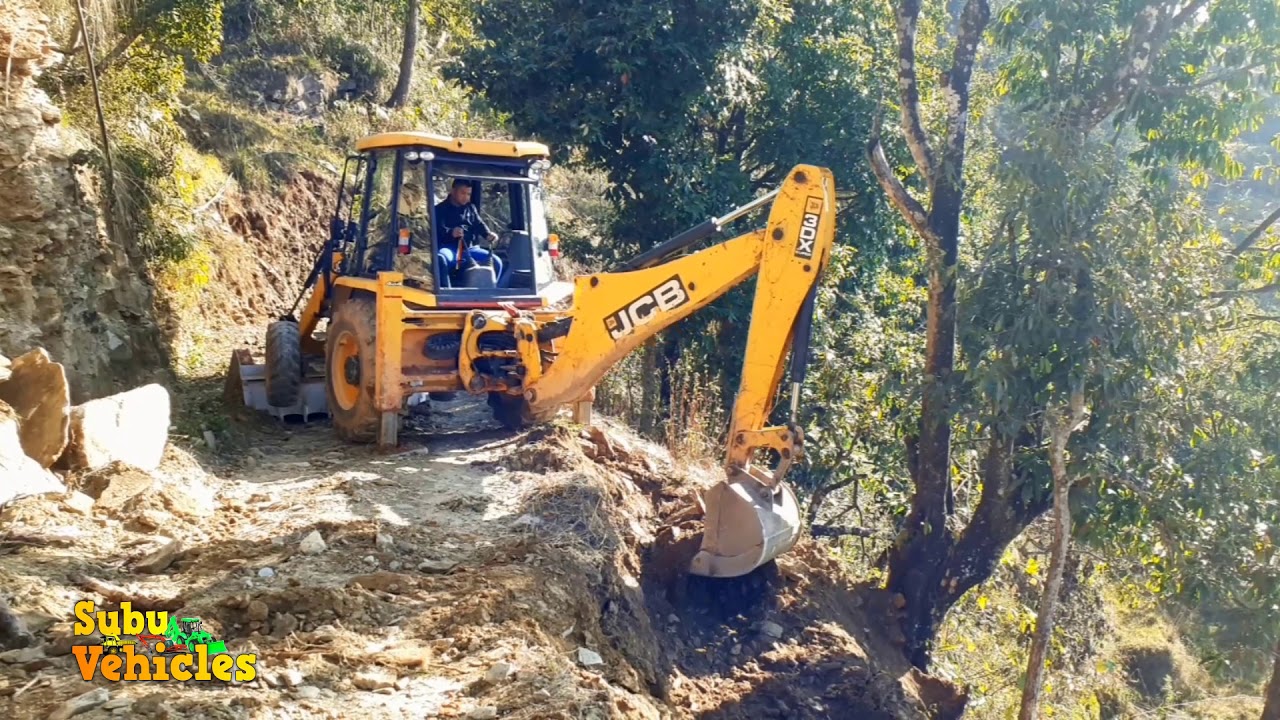JCB Dojer working for making wide road in hilly area - YouTube