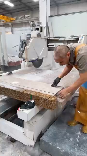 Carefully measuring newly cut marble slabs straight from our automated stone cutting machine ...